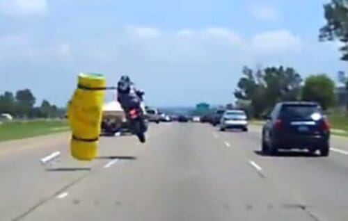 Rider crashes into unsecured load - webBikeWorld